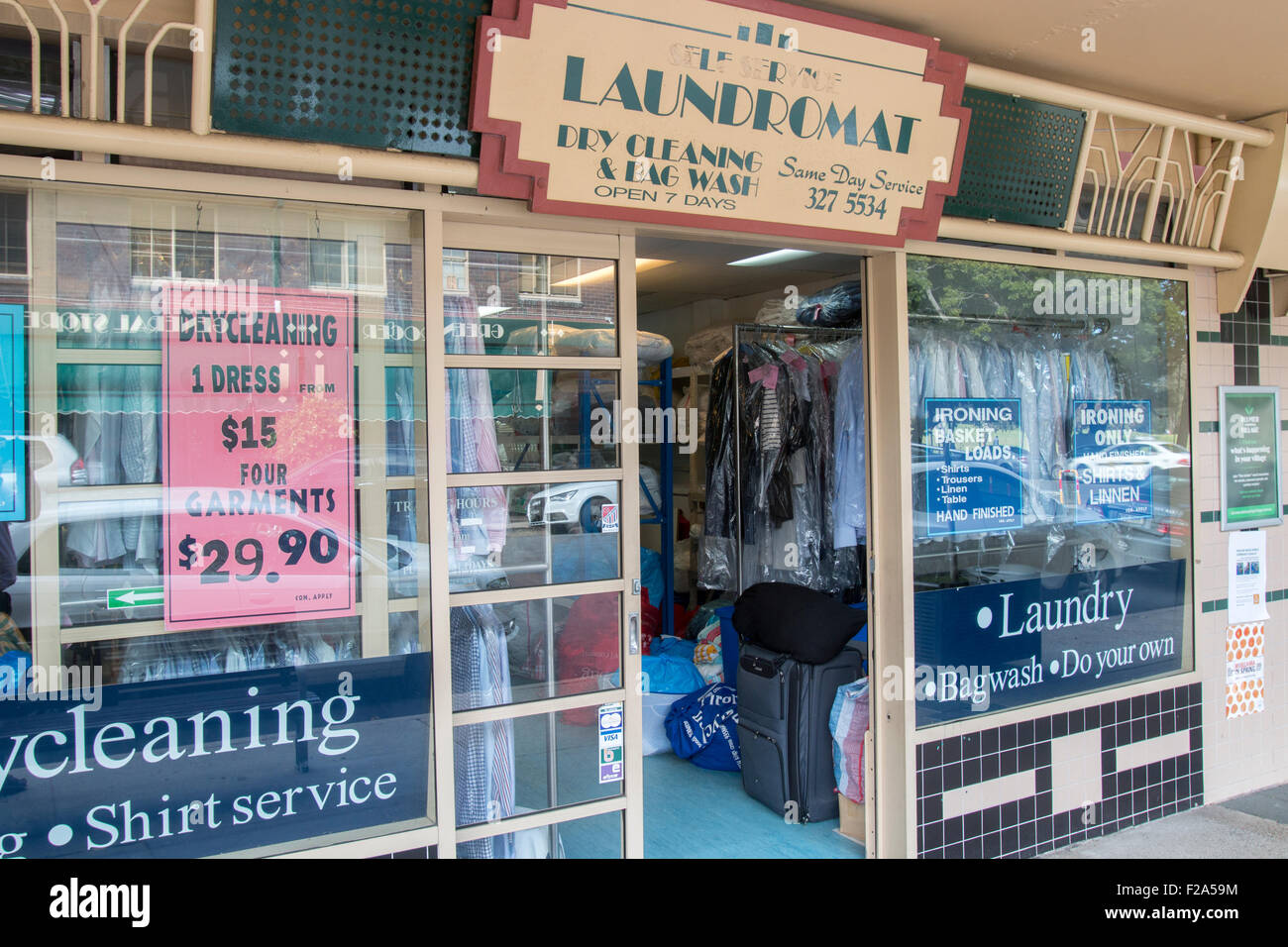 Parade of shops and traditional laundry dry cleaning laundromat in ...