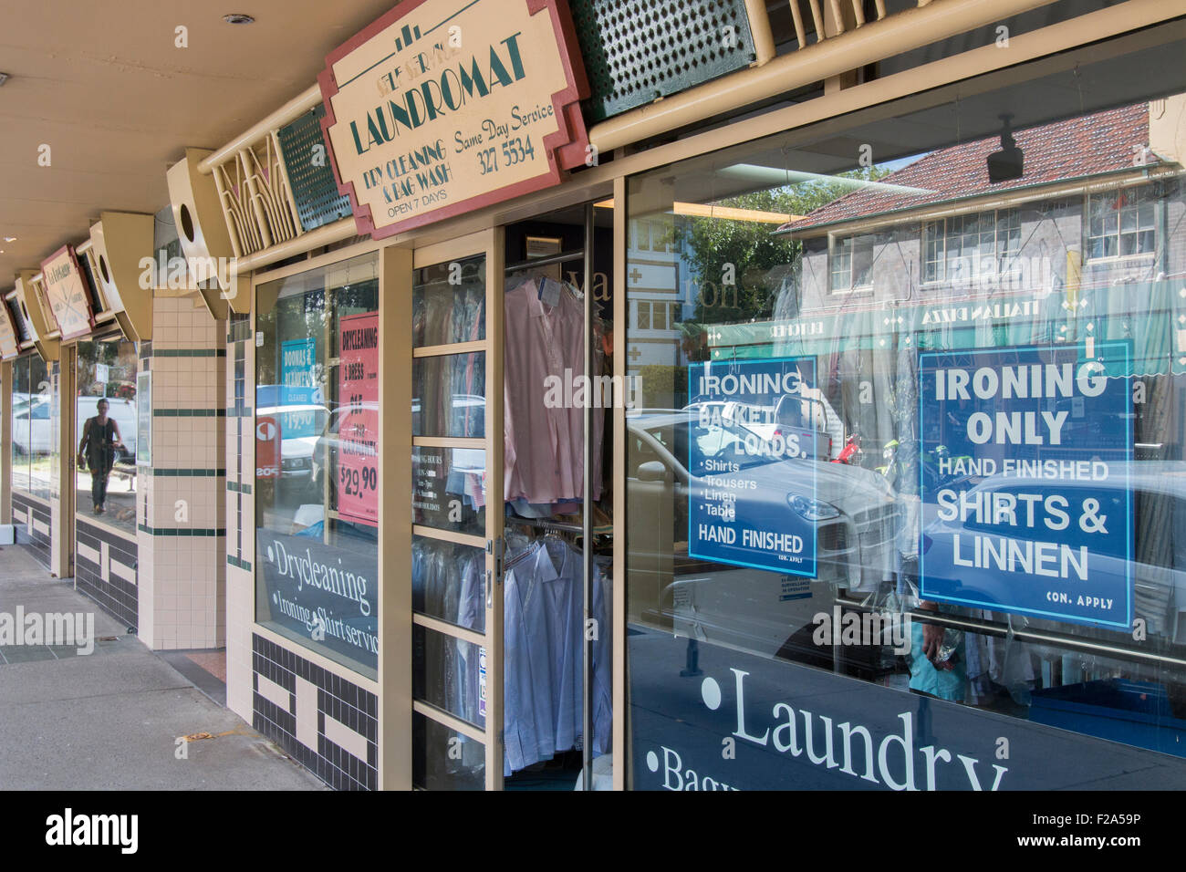 Parade of shops and traditional laundry dry cleaning laundromat in ...