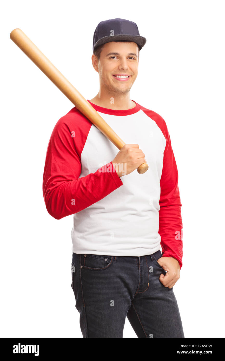 Vertical shot of a young male baseball player holding a baseball bat ...