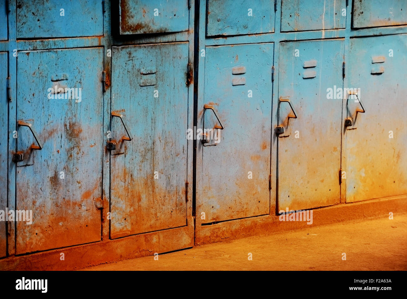 Old and rusty blue lockers abandoned inside industrial building Stock ...