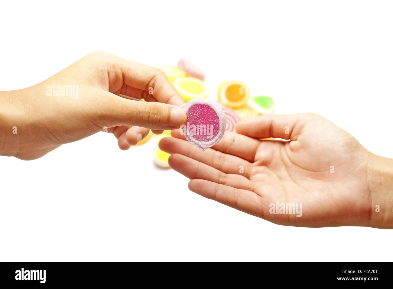 human hand pick up jelly sweet candy isolated on white background Stock ...