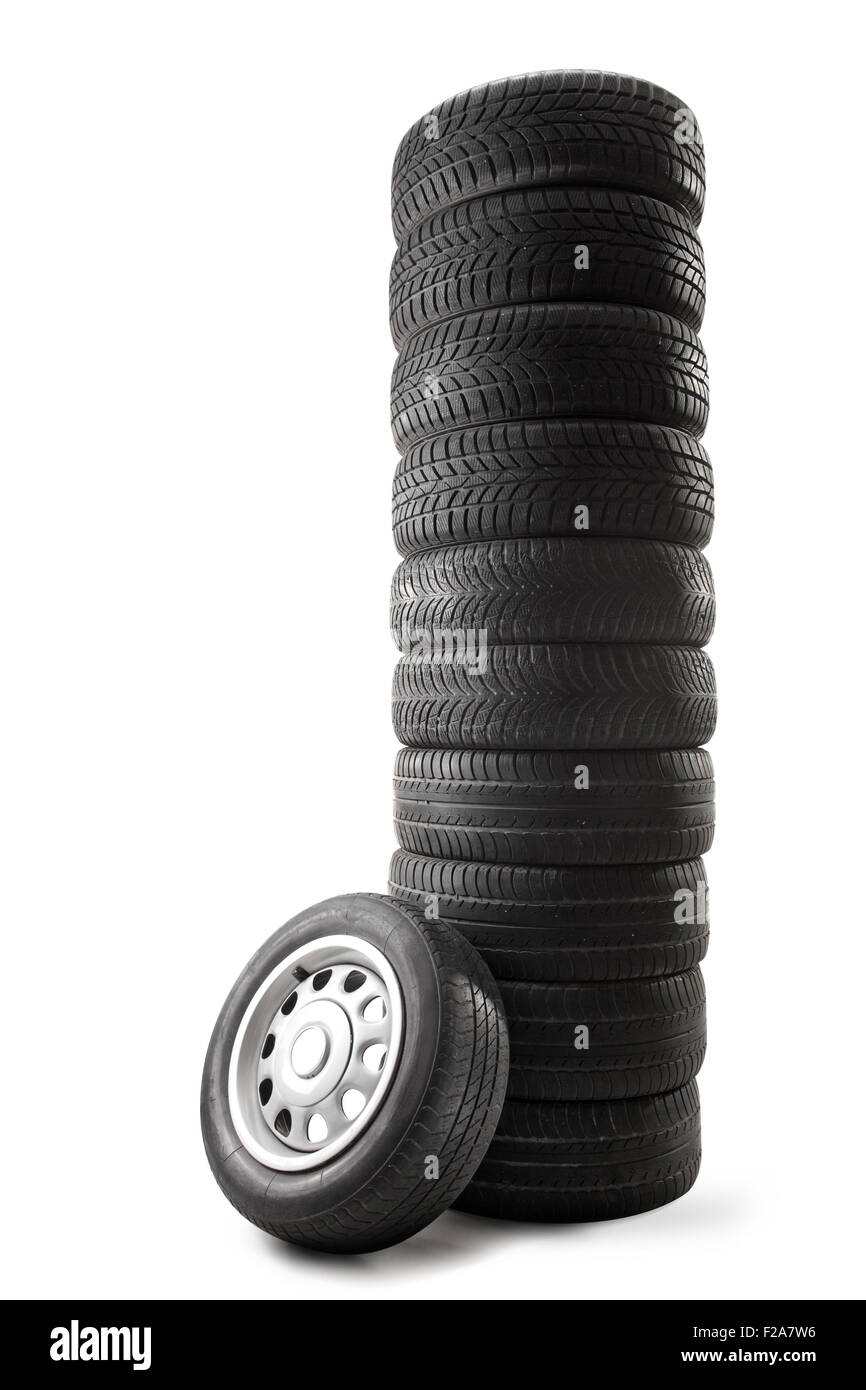 Vertical studio shot of a stack of tires piled up vertically isolated ...