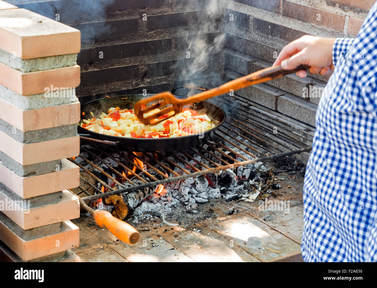 Making a paella at barbecue Stock Photo - Alamy