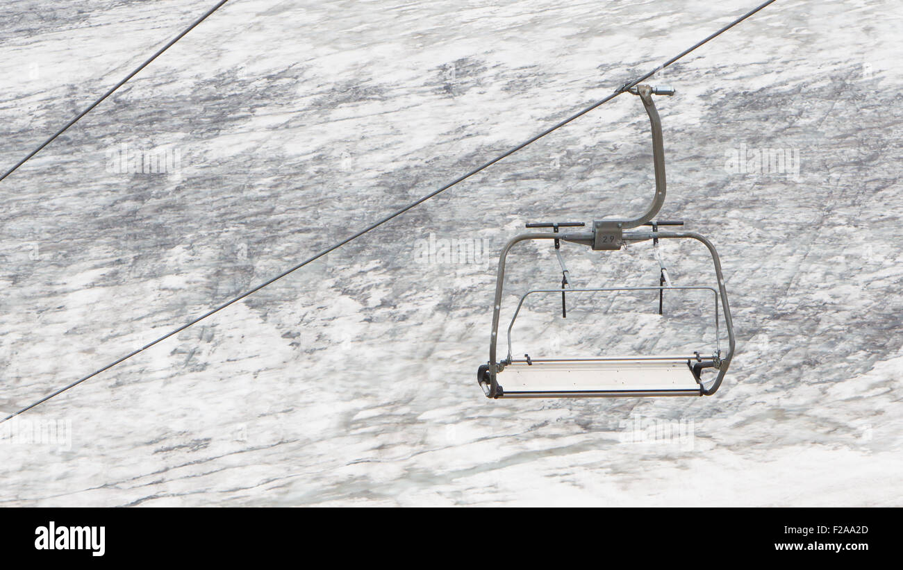 Empty ski lift above snow, mountains in Switzerland Stock Photo - Alamy