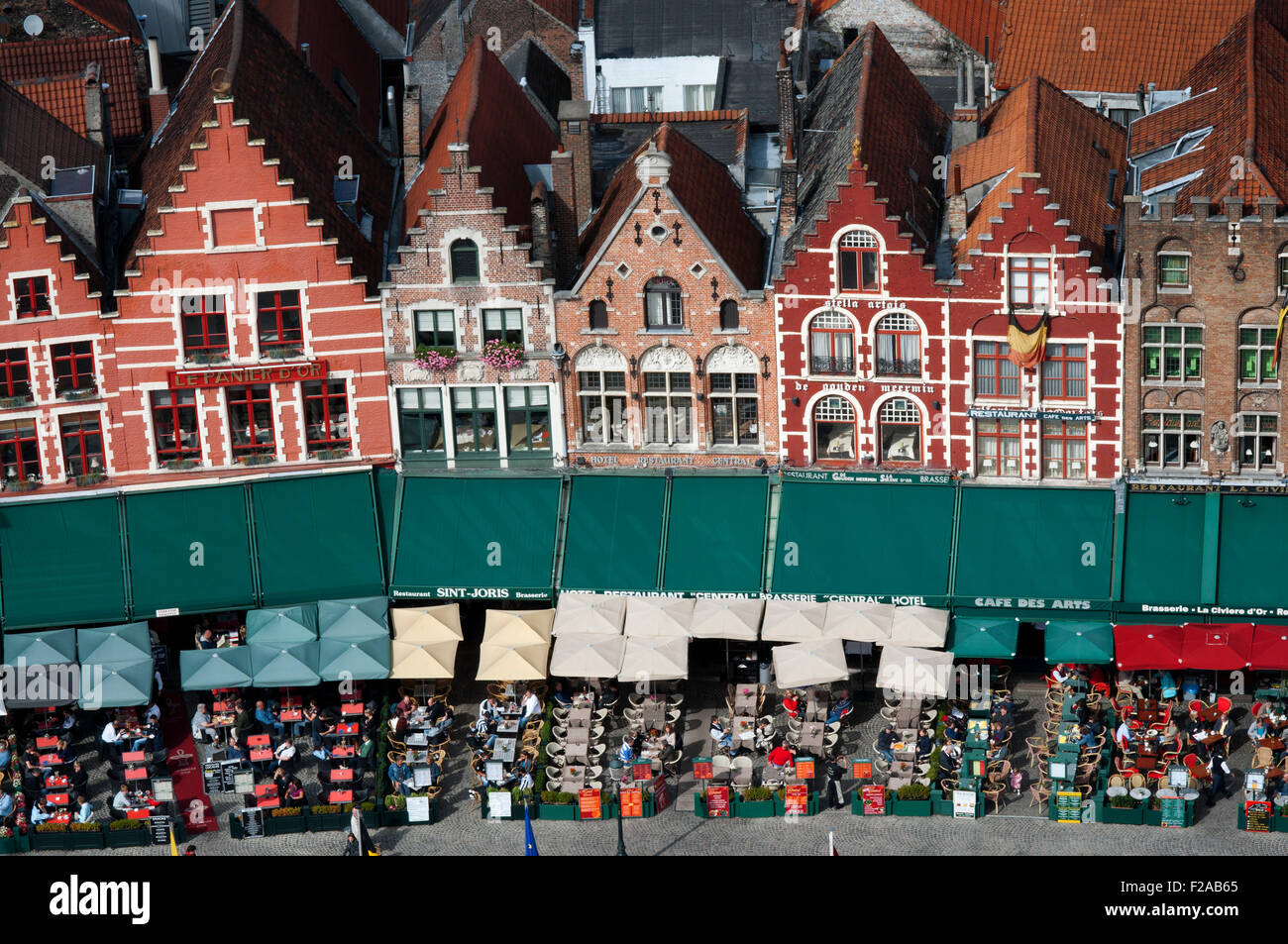 Row of ornate historic buildings in Market Square in Bruges in Belgium ...