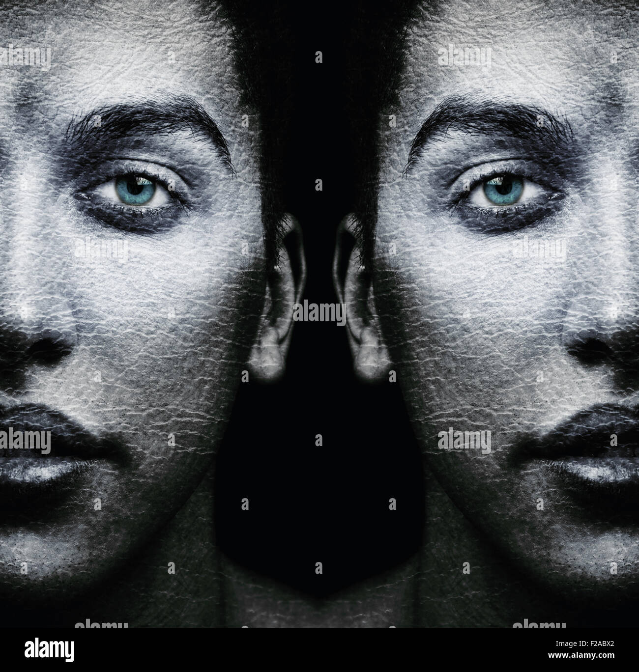 Textured faces of surreal male twins over black Stock Photo - Alamy