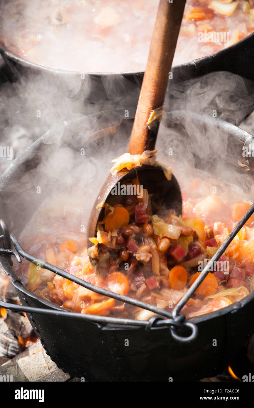 Soup cooking in medieval pot Stock Photo - Alamy