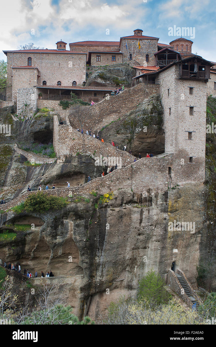Tourists walking up the stairs into the Holy Monastery Of Great ...