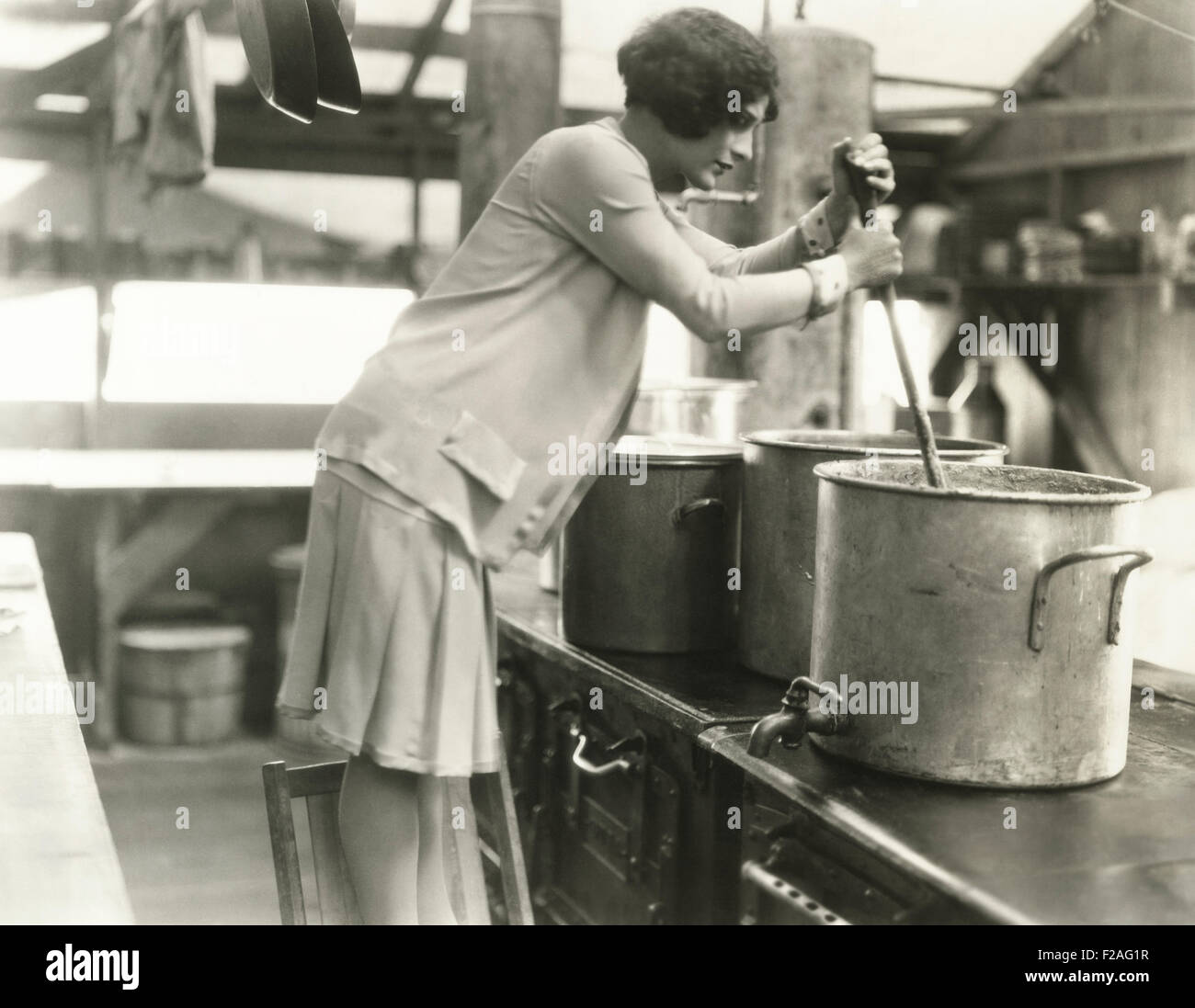 Woman 1920s kitchen hi-res stock photography and images - Alamy