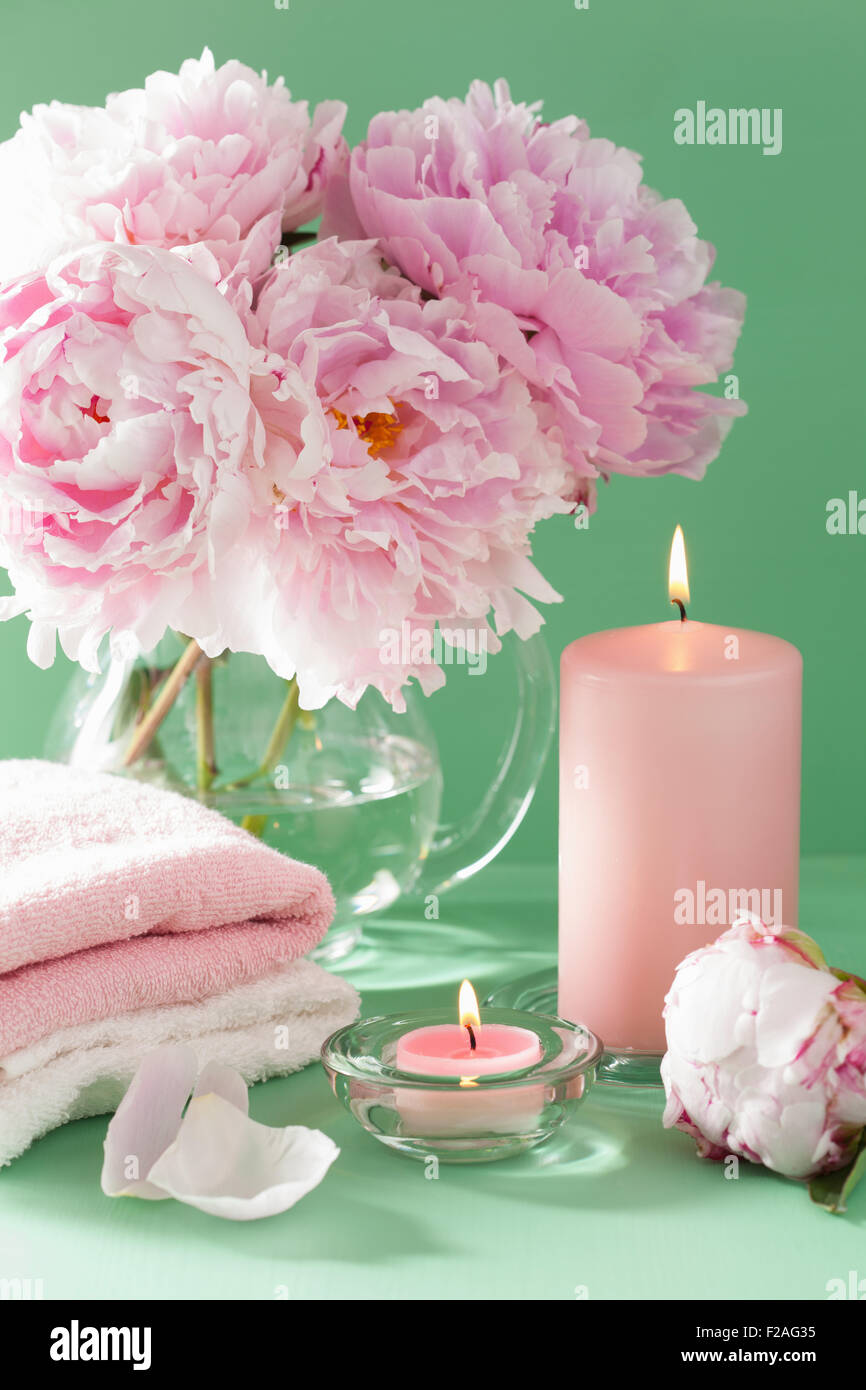 bath and spa with peony flowers candles towels Stock Photo - Alamy