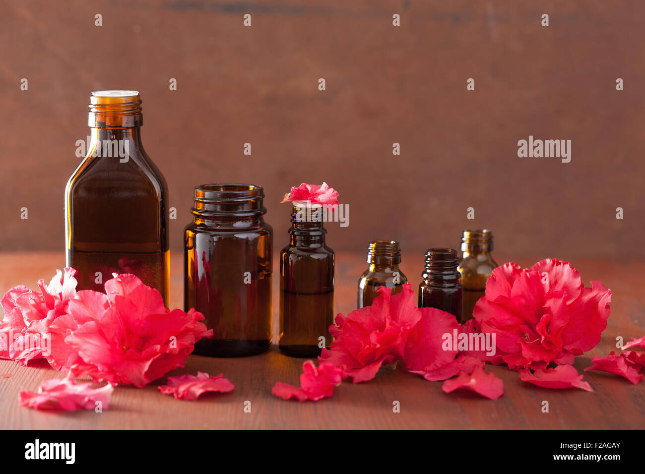 essential oil azalea flowers on dark rustic background Stock Photo - Alamy