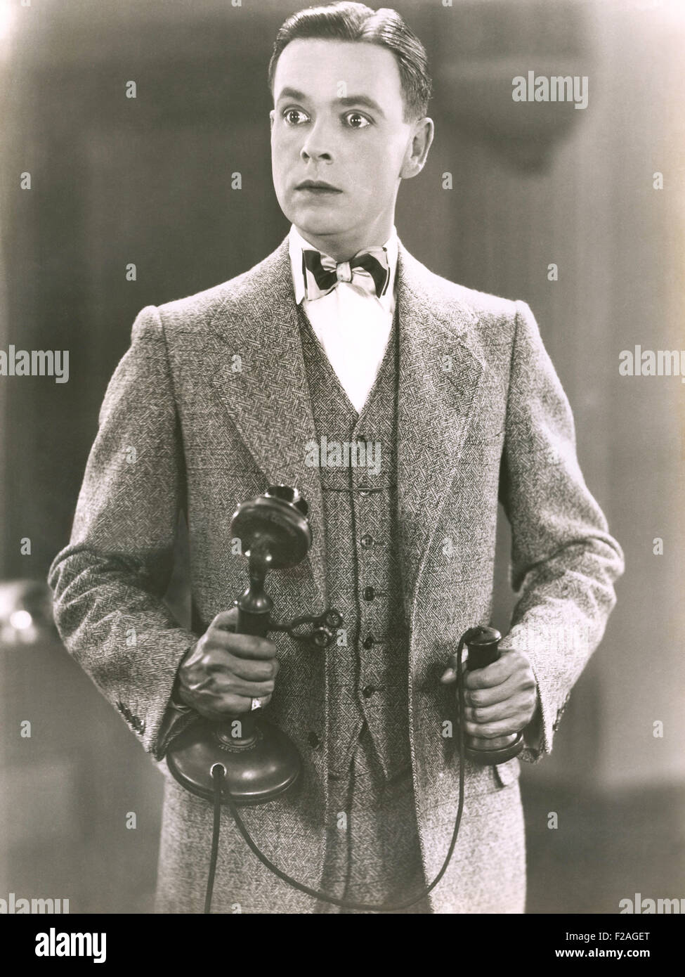 Man on phone is taken off guard (OLVI008 OU141 F Stock Photo - Alamy