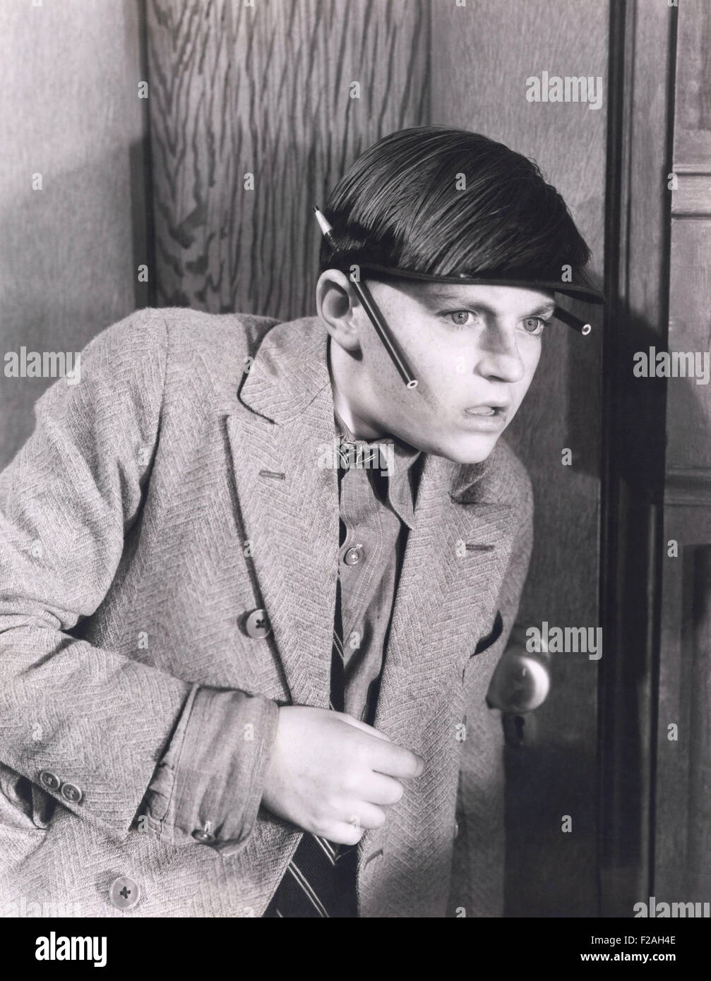 Boy eavesdropping at door (OLVI008 OU020 F Stock Photo - Alamy