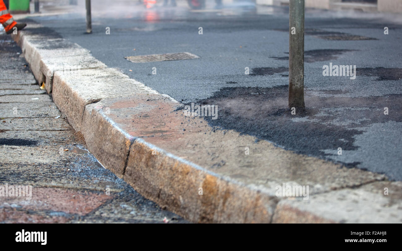 Photo of new Asphalt smoking Stock Photo - Alamy