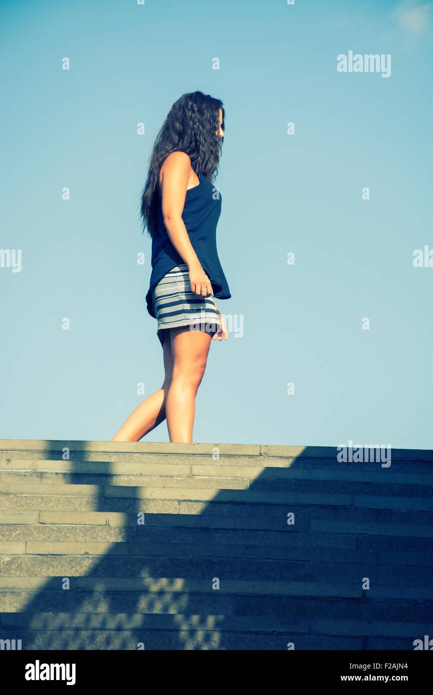 Woman side profile walking hi-res stock photography and images - Alamy
