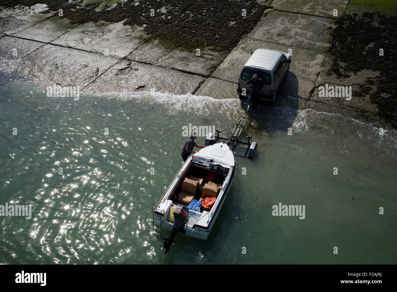 two men loading small boat onto trailer, Le Treport, Normandy, France ...