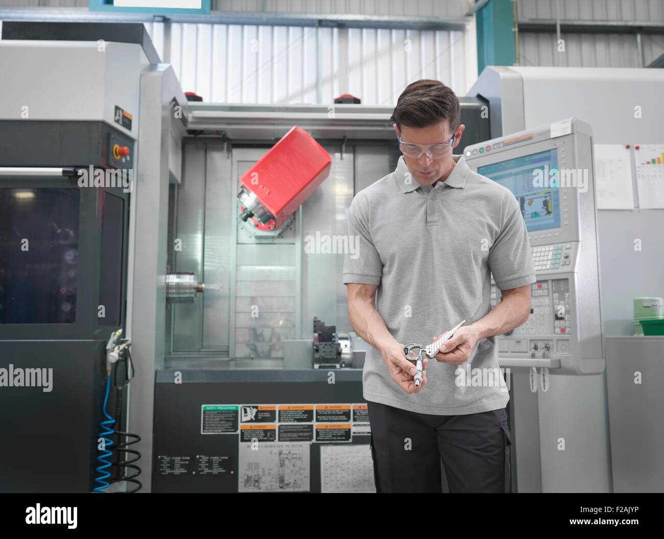 Engineer with cnc lathe making hi-res stock photography and images - Alamy