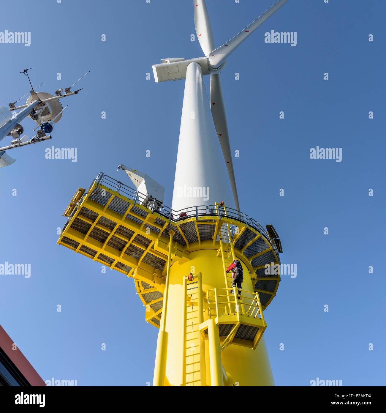 Man climbing wind turbine man wind farm hi-res stock photography and ...