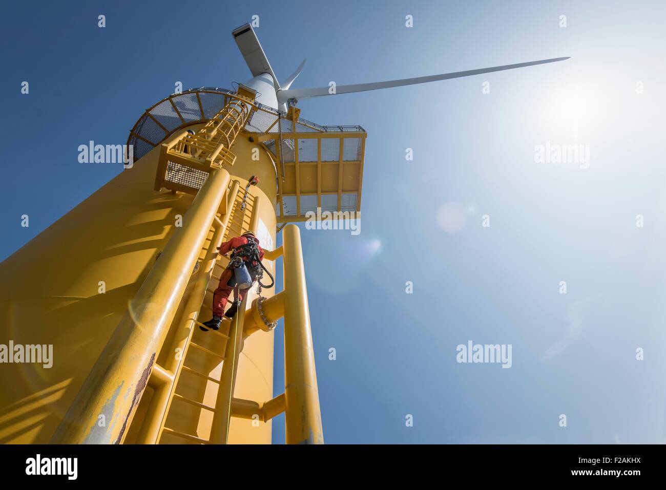 Man climbing wind turbine man wind farm hi-res stock photography and ...