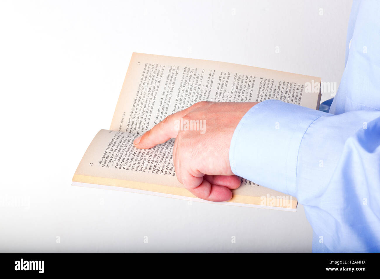 Man reading a book isolated on a white background Stock Photo - Alamy