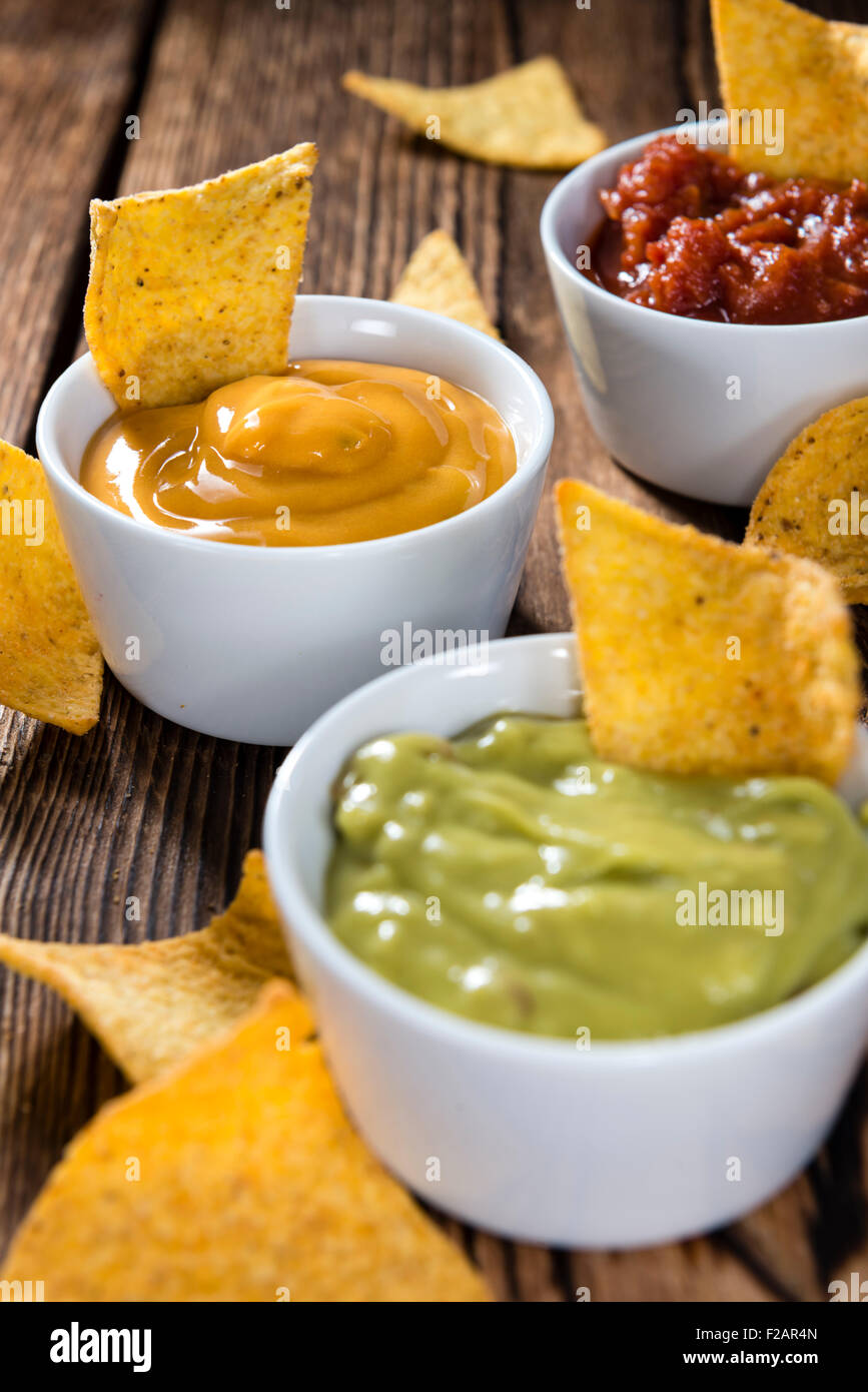Three different nacho dips (Salsa, Cheese and Guacamole Stock Photo - Alamy