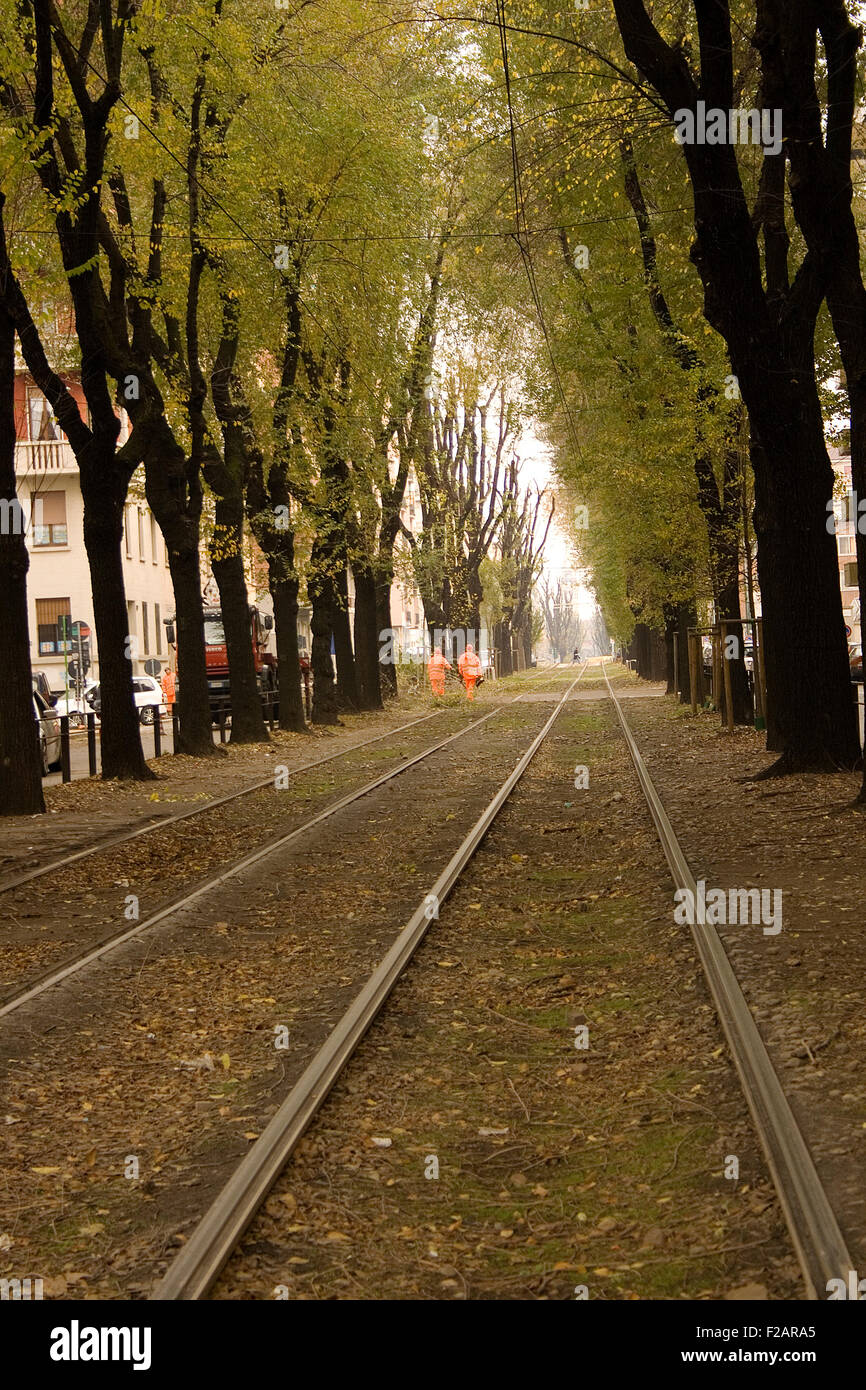 Garbage mans cleaning tram tracks Stock Photo - Alamy