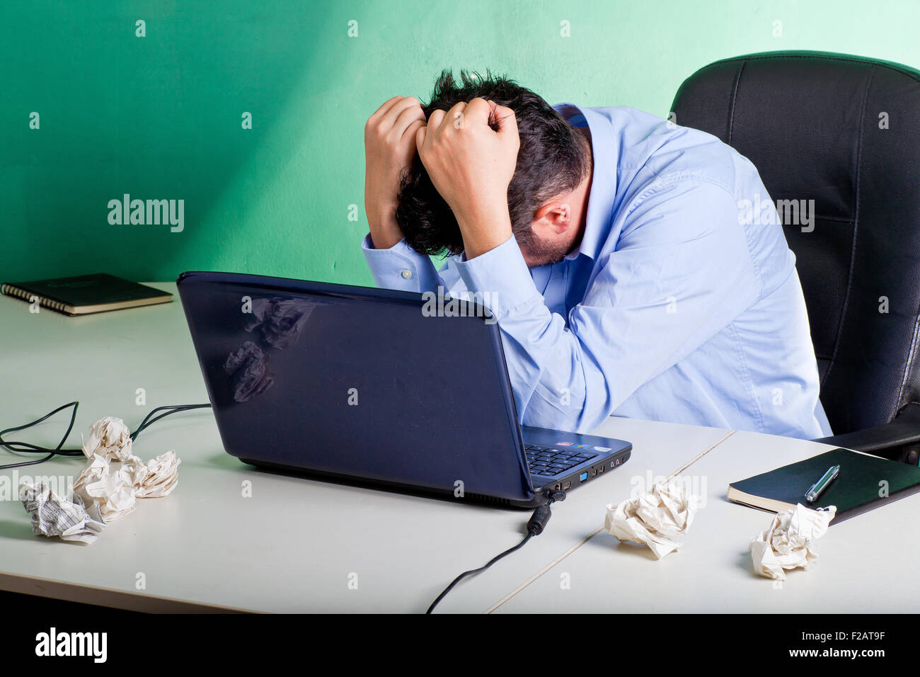 Frustrated and desperate businessman in his office Stock Photo - Alamy