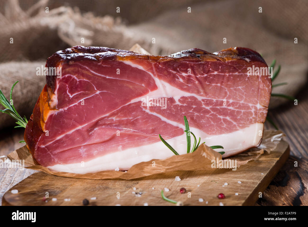 Big slice of smoked Ham (detailed close-up shot) with fresh herbs Stock ...