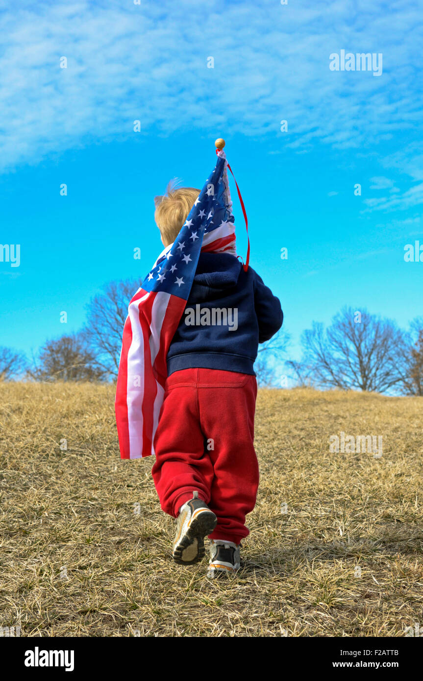 Child carrying American Flag Stock Photo - Alamy