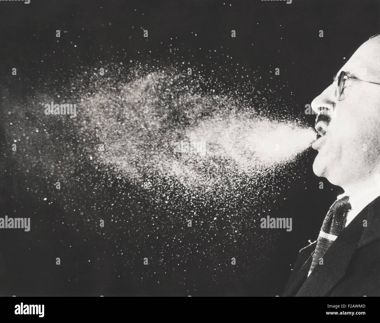 High speed strobe photograph of a cloud of droplets 'stopped' in full ...