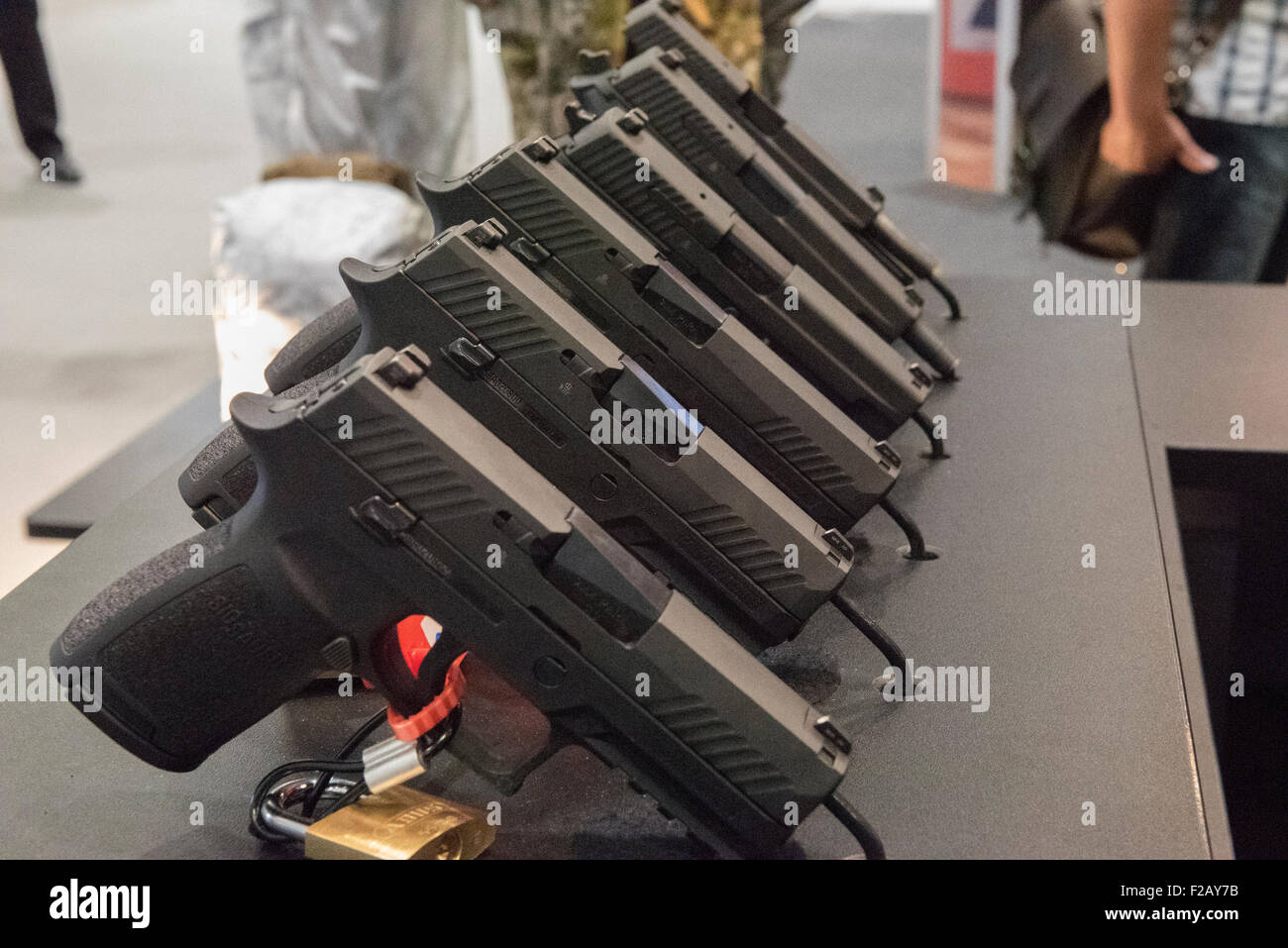London, UK. 15th September, 2015. A row of handguns on display at DSEI ...