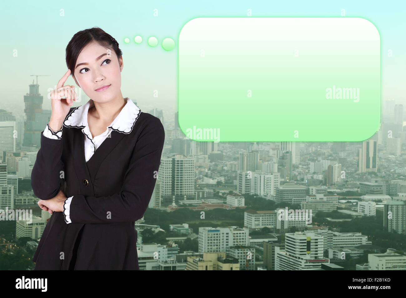 Thinking business woman with many ideas in empty bubble with city ...