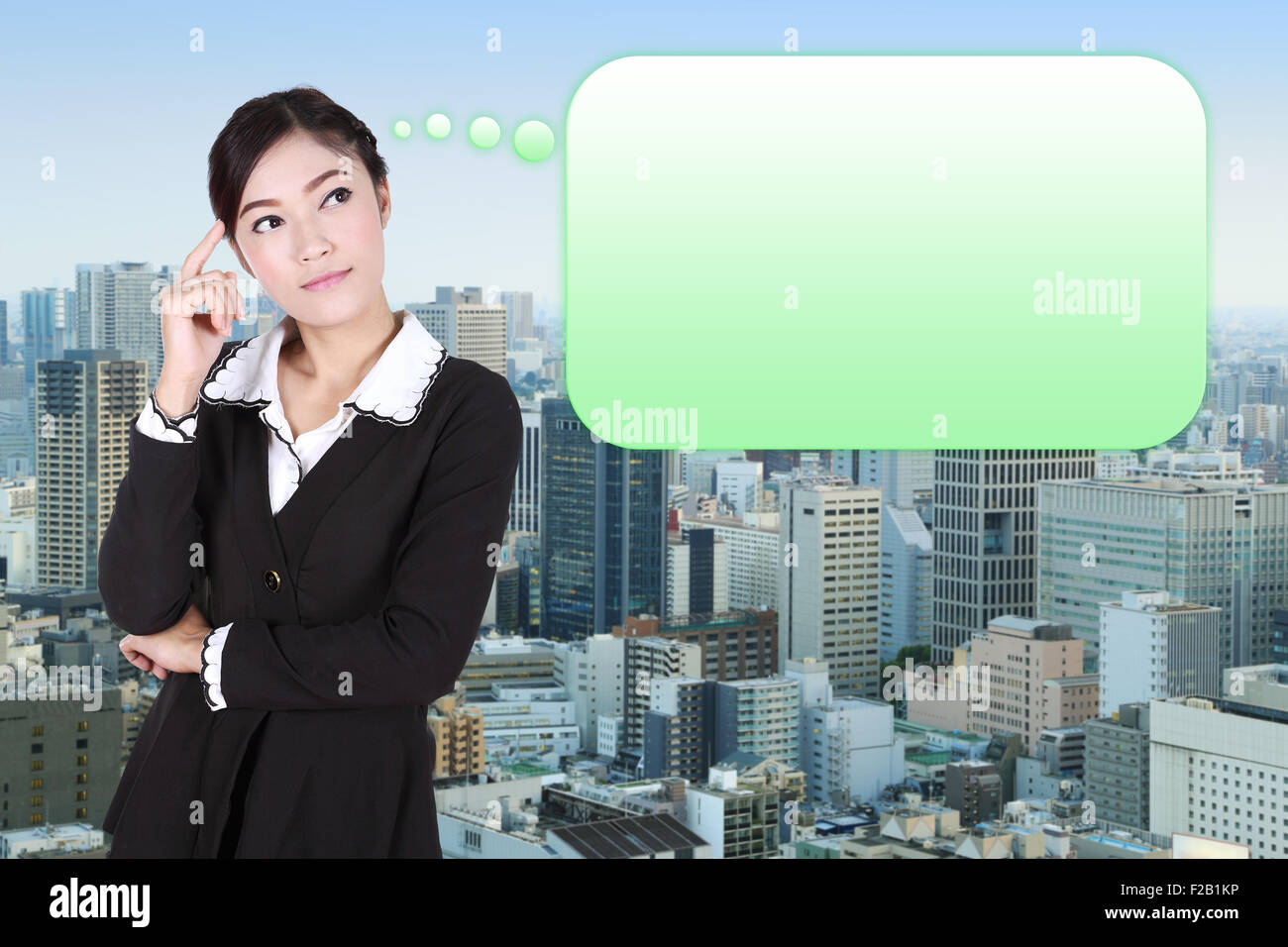 Thinking business woman with many ideas in empty bubble with city ...