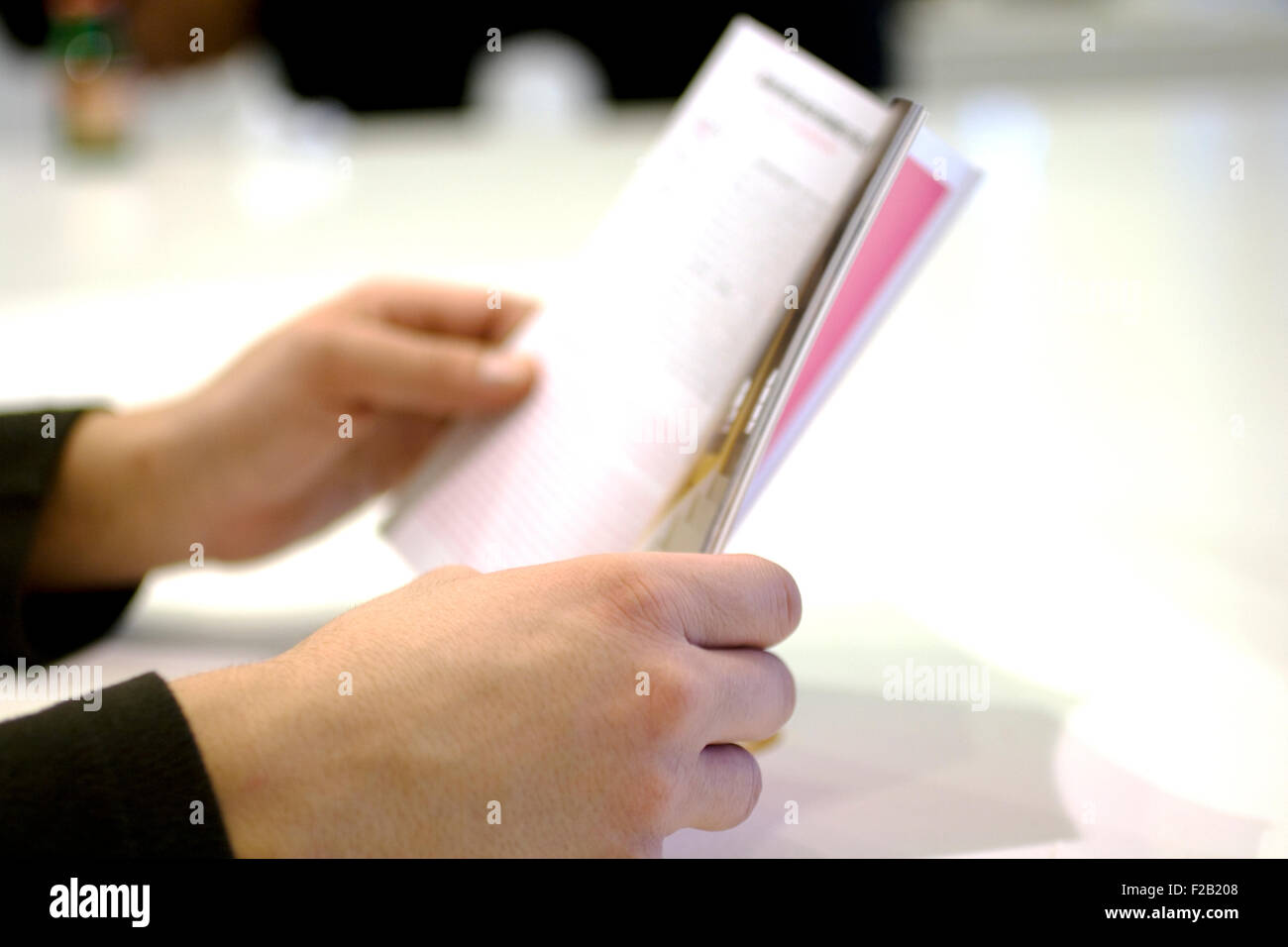 Hands of Man that Reading a book Stock Photo - Alamy