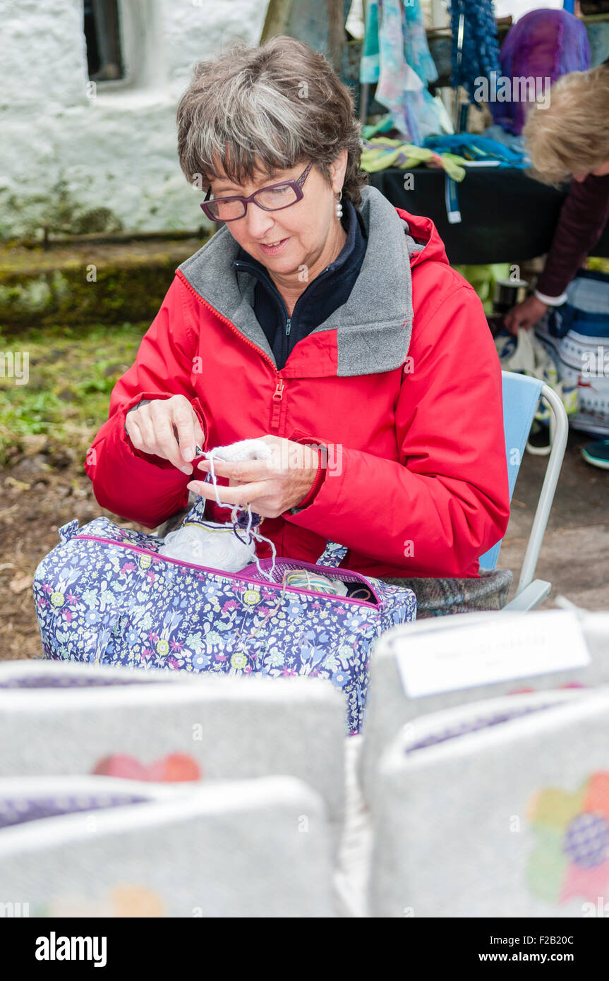 Woman sewing traditional cloth hi-res stock photography and images - Alamy