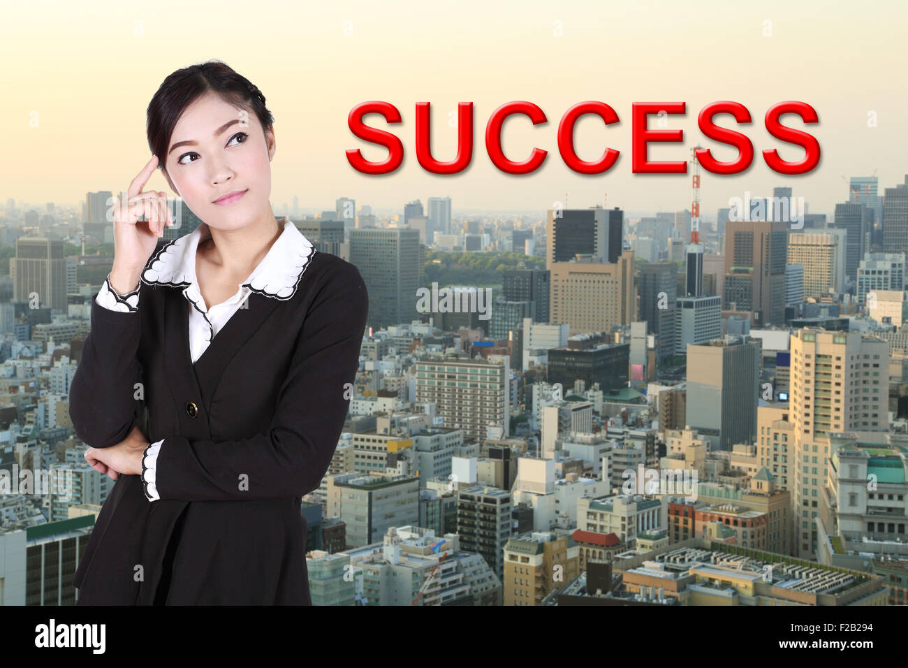 business woman thinking about "success" with city background Stock ...