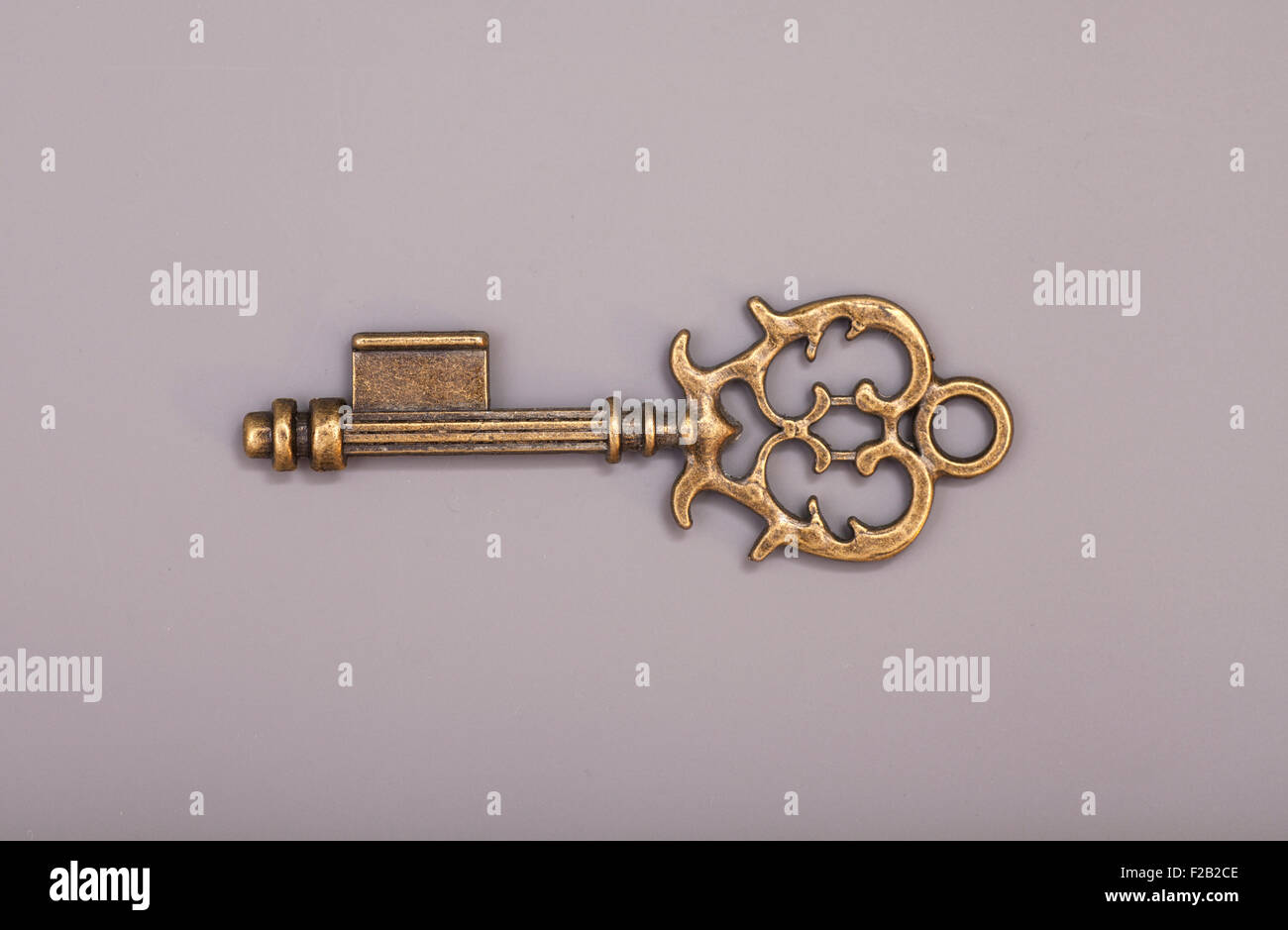 Vintage Key on gray background Stock Photo - Alamy