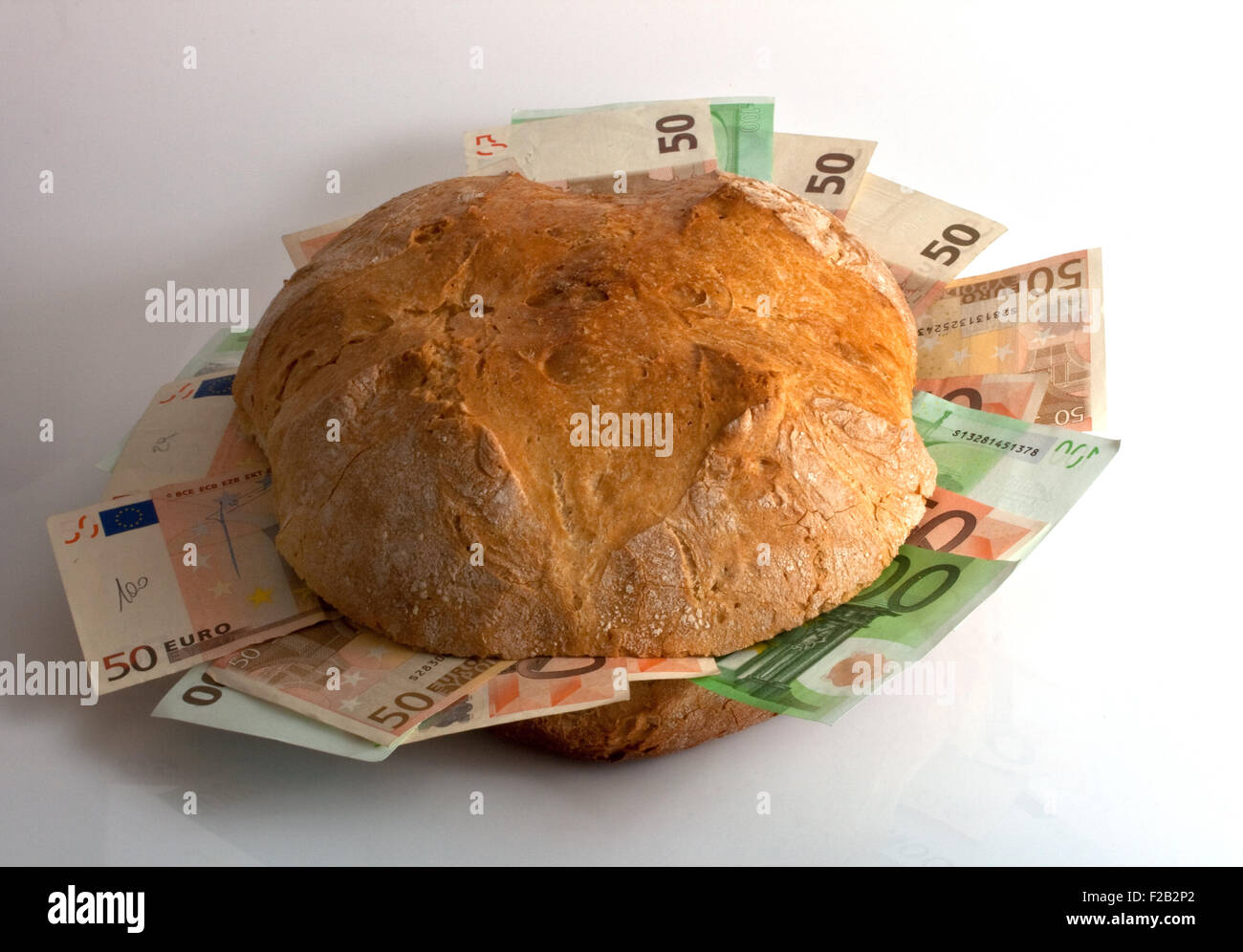 Bread with bills isolated on a white background Stock Photo - Alamy