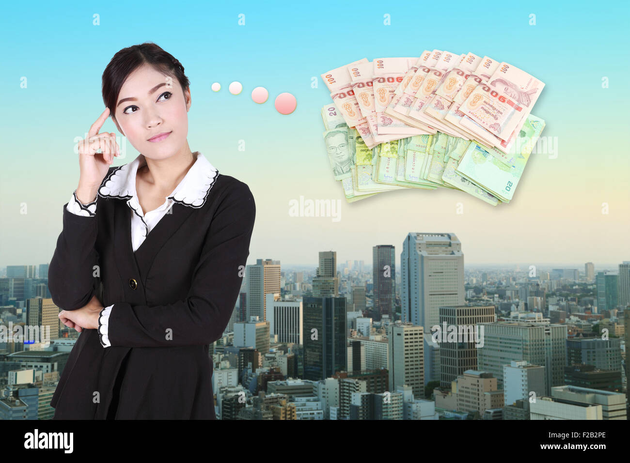 Business woman thinking about money with city background Stock Photo ...