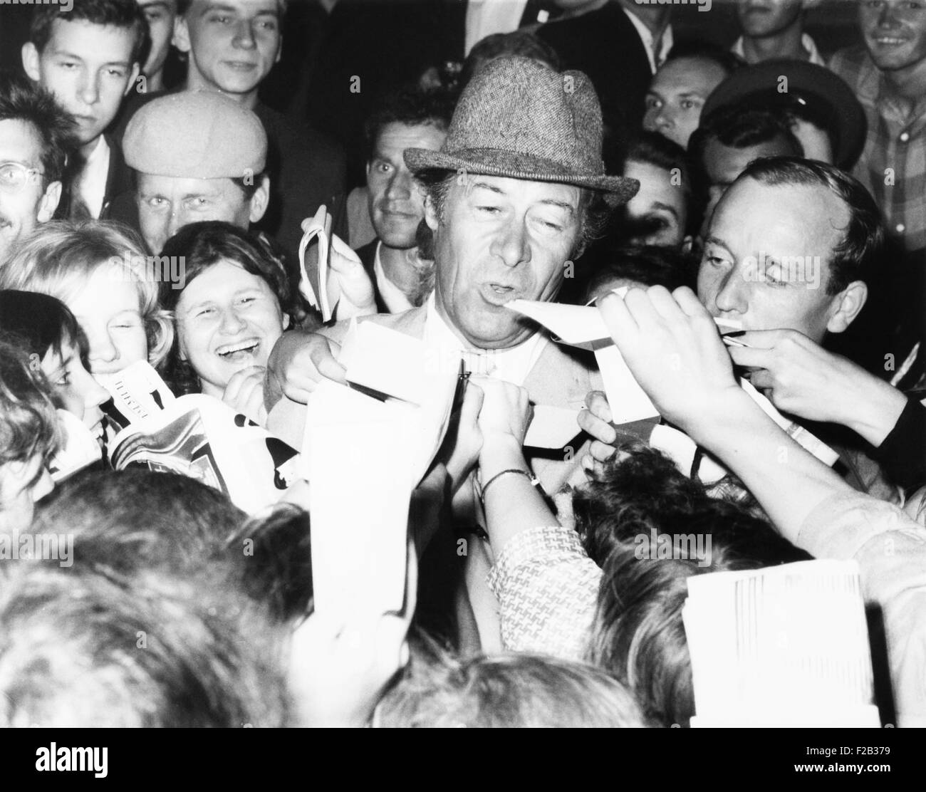 British Actor Rex Harrison stepped into a swarm of Russian autograph ...