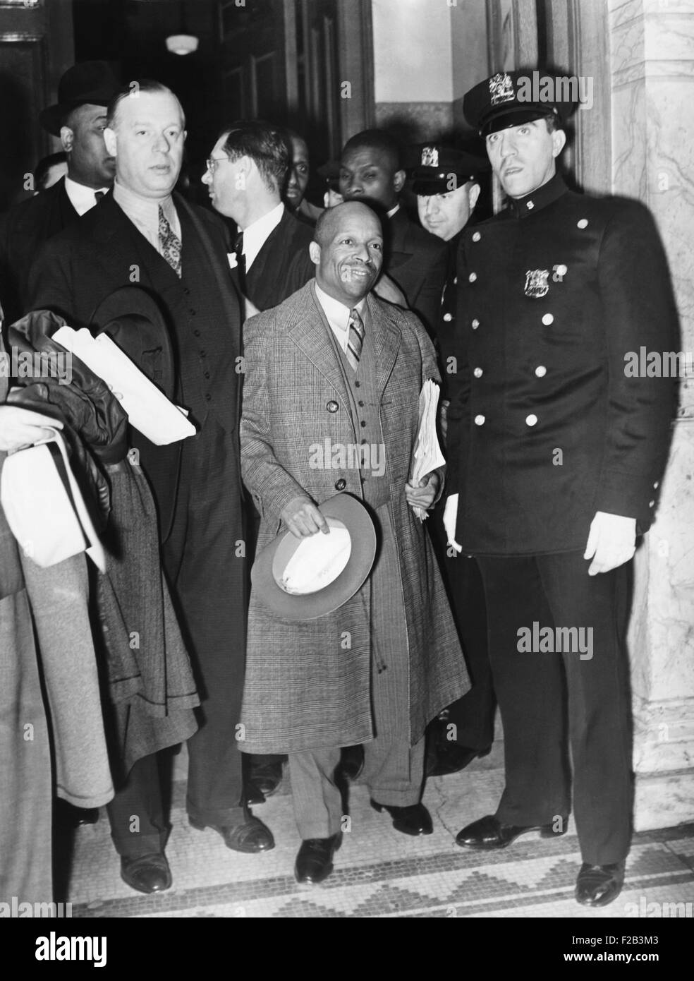 Guarded by a policeman, Father Divine, leaves Felony Court, NYC, April ...