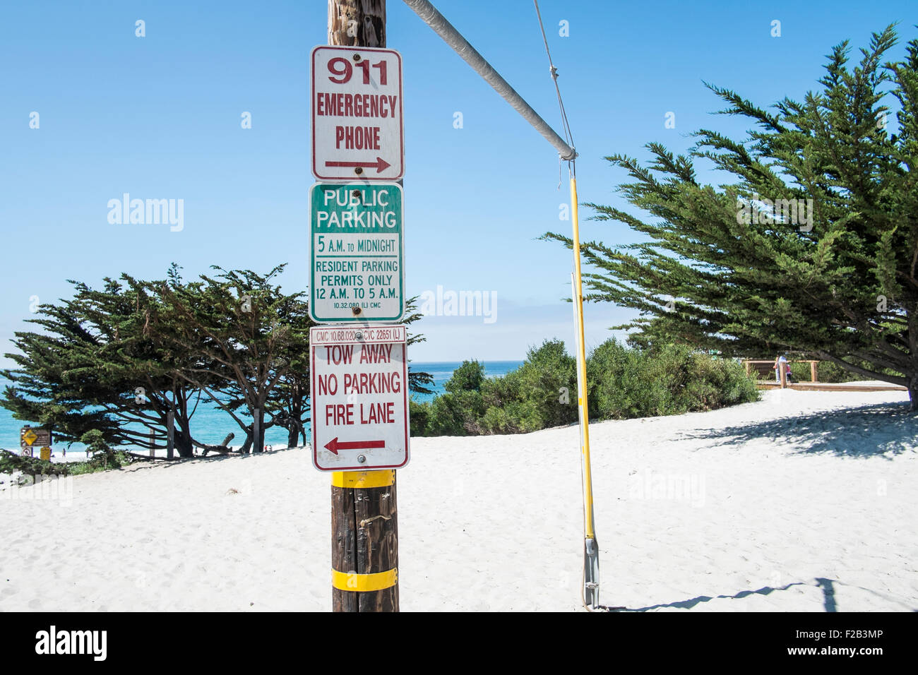 Road signs on Telegraph pole next to beach Stock Photo - Alamy