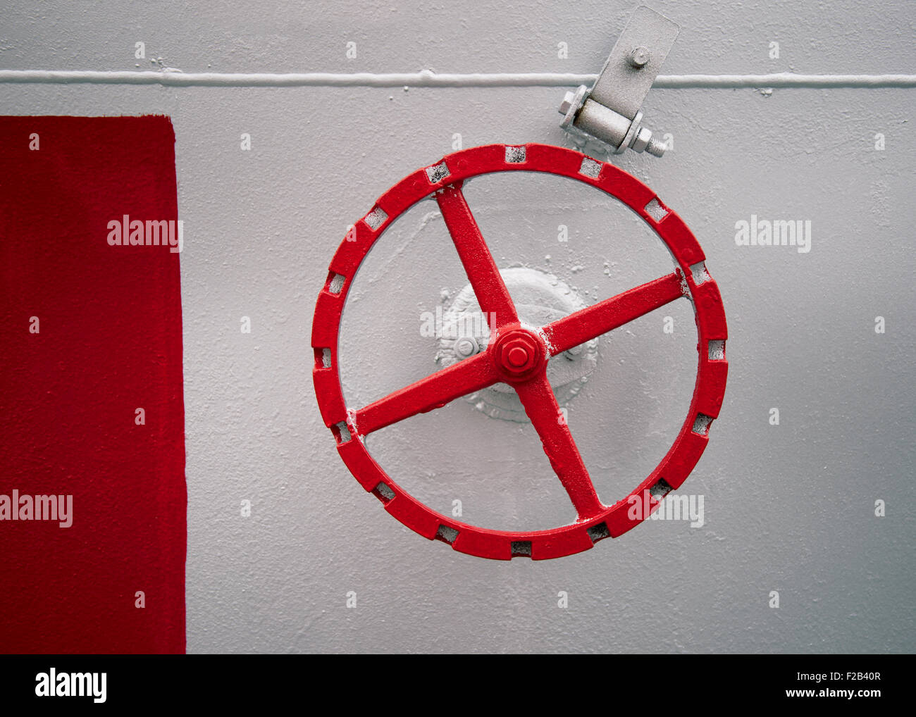 old red hand wheel on the wall of tank Stock Photo - Alamy