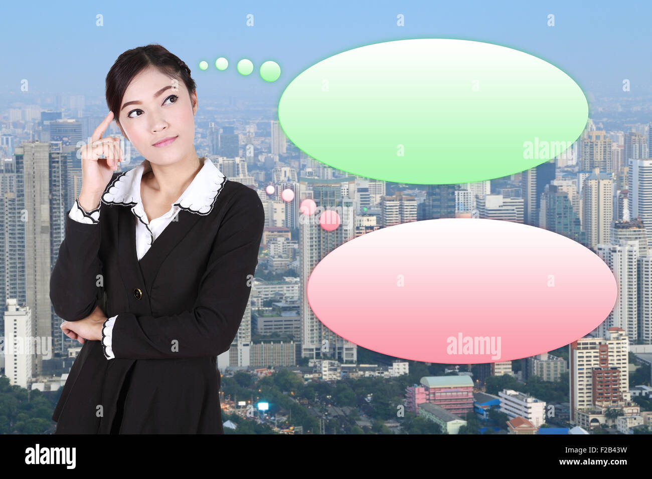 Thinking business woman with many ideas in empty bubble with city ...