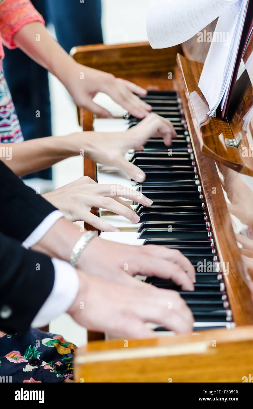 Few people playing piano together Stock Photo - Alamy