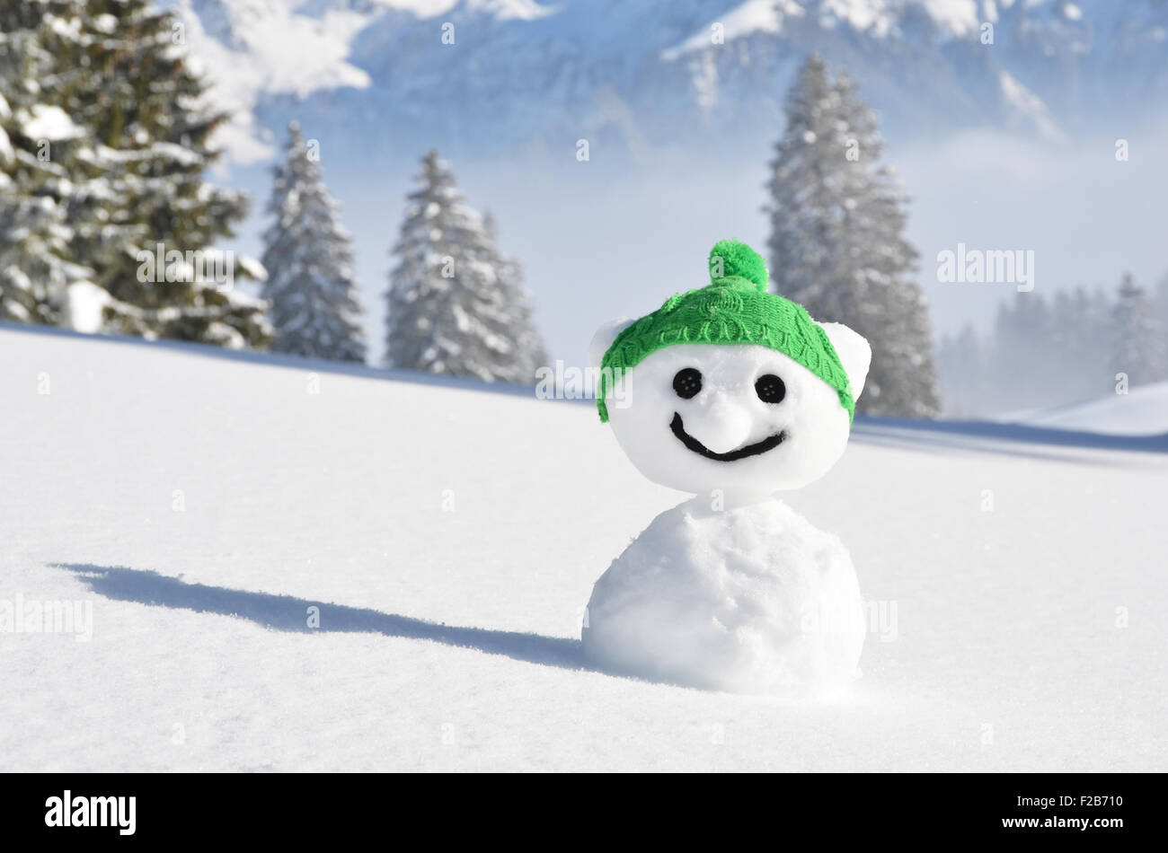 Snowman in the knitted cap Stock Photo - Alamy