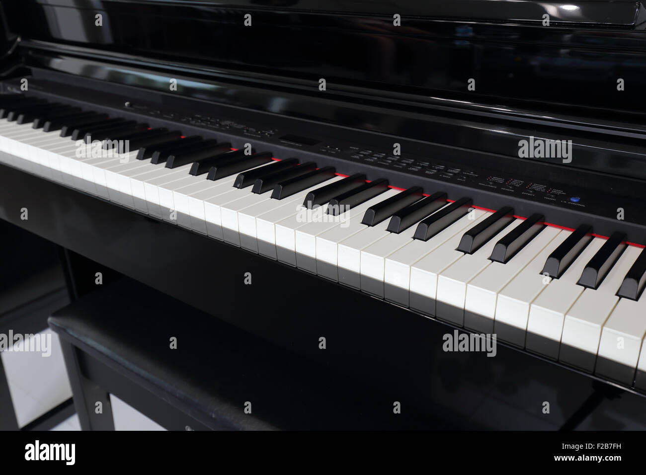A black electronic piano with piano keys Stock Photo - Alamy