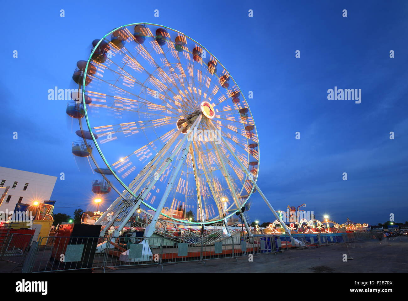 Ferris Wheel(motion) at amusement park at twilight time Stock Photo - Alamy