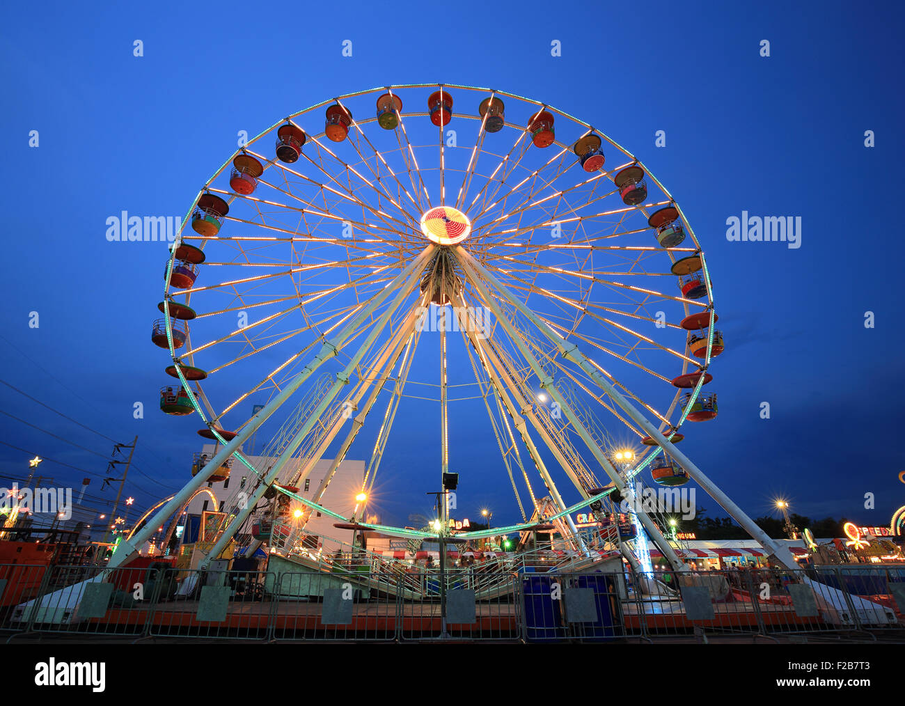Ferris Wheel at amusement park at twilight time Stock Photo - Alamy