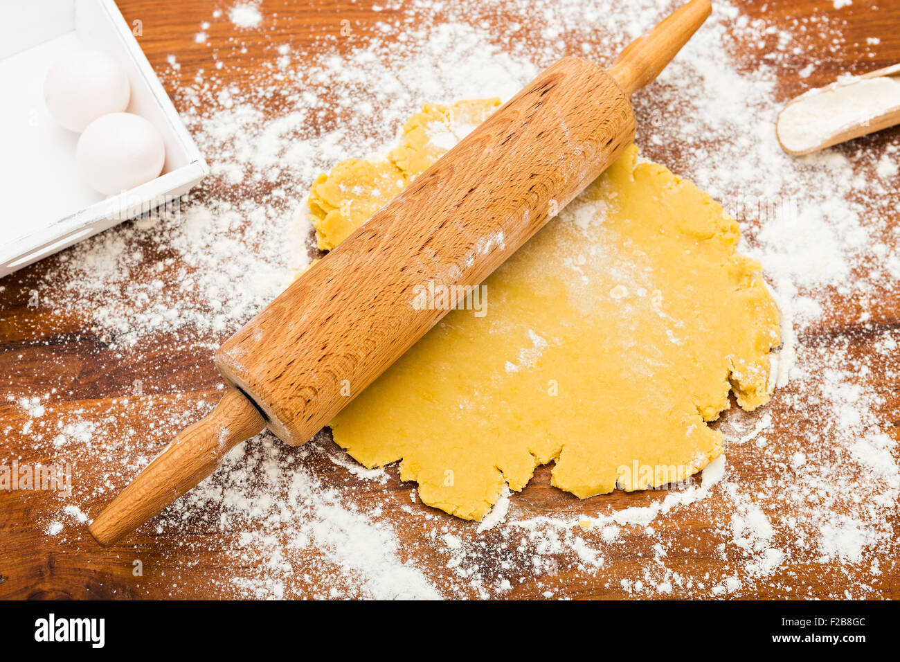 Rolling pin with paste Stock Photo - Alamy